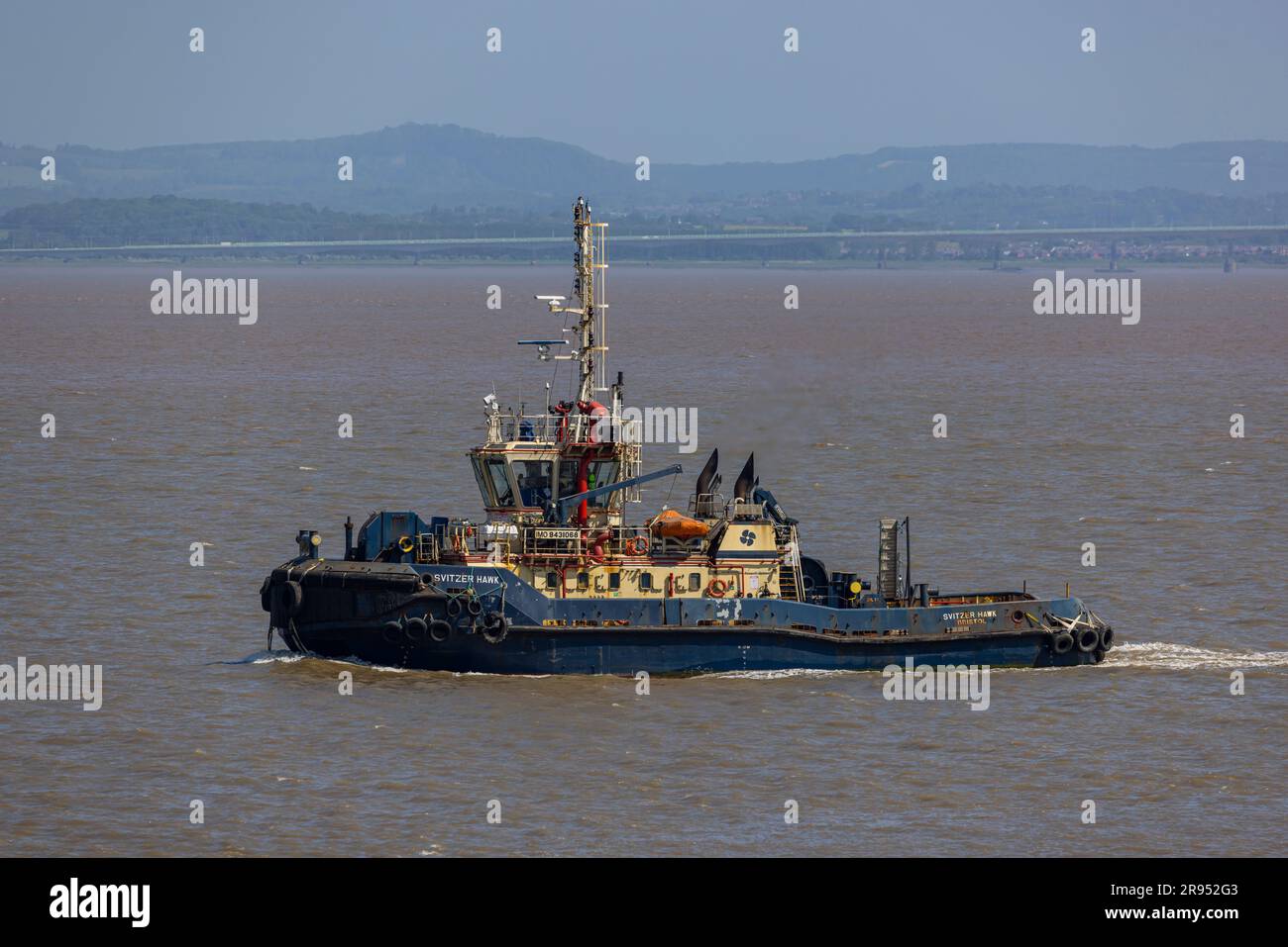 Tug Svitzer Hawk going out to meet a vessel to take them into the docks ...