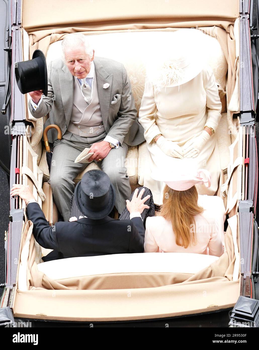 The carriage carrying King Charles III, Queen Camilla, The Earl of ...