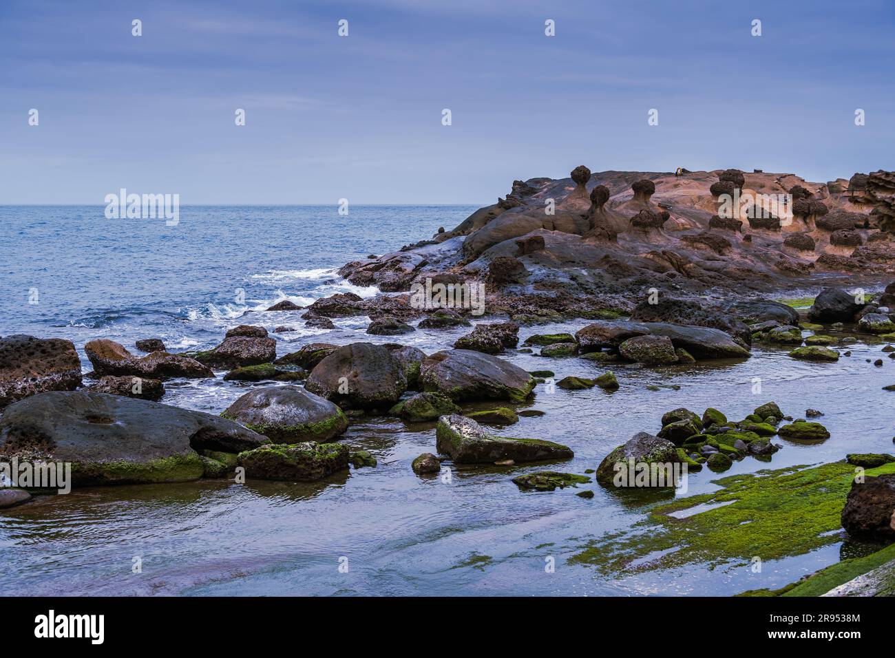 An image of the shoreline of Yehliu Geopark with rock formations ...