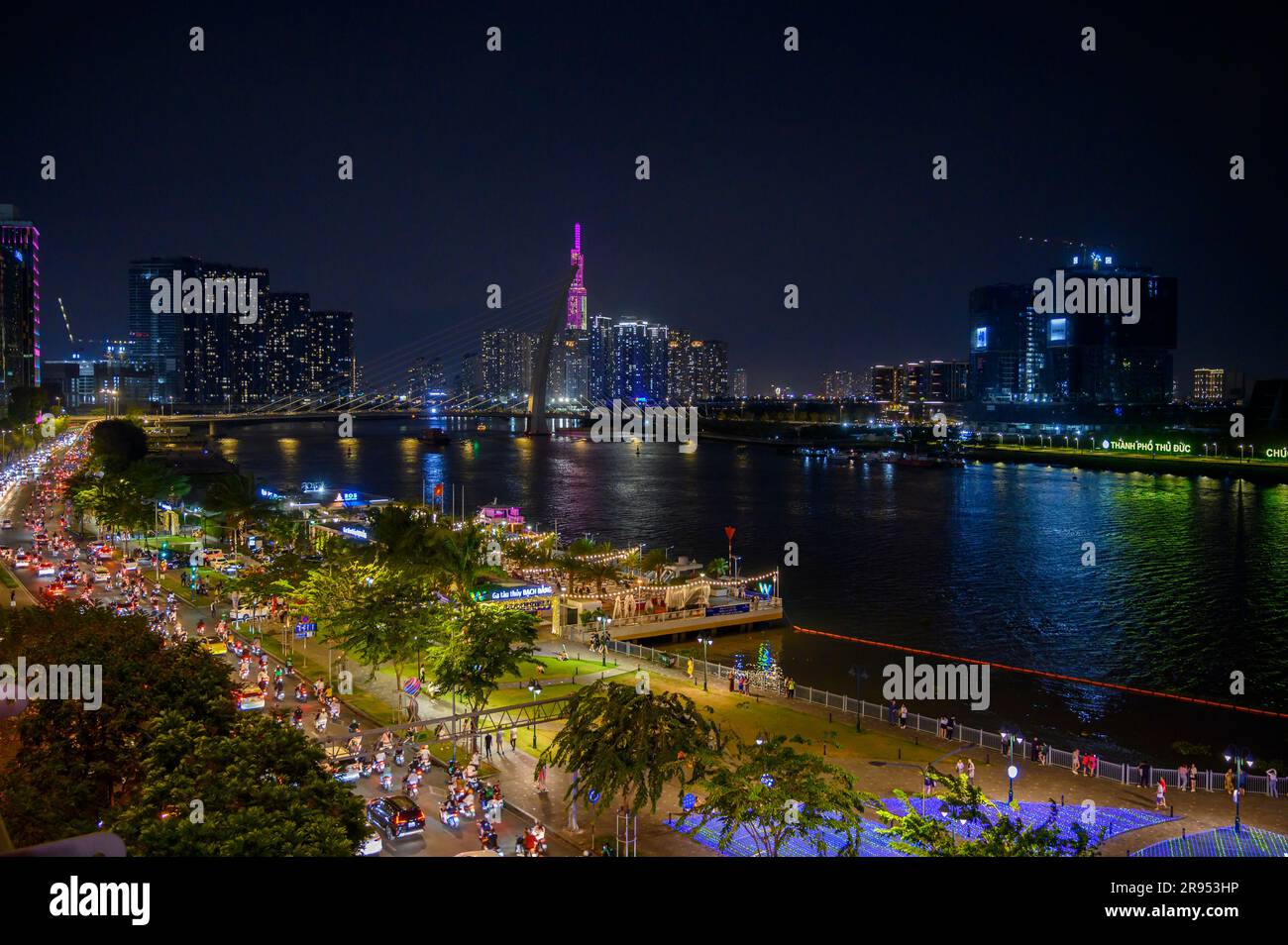Nighttime view of Saigon River, Ba Son bridge and Vinpearl Landmark 81 ...
