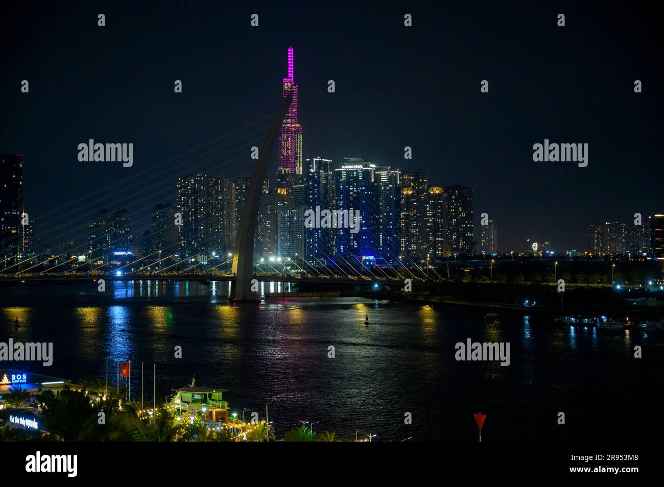 Nighttime view of Saigon River, Ba Son bridge and Vinpearl Landmark 81 ...