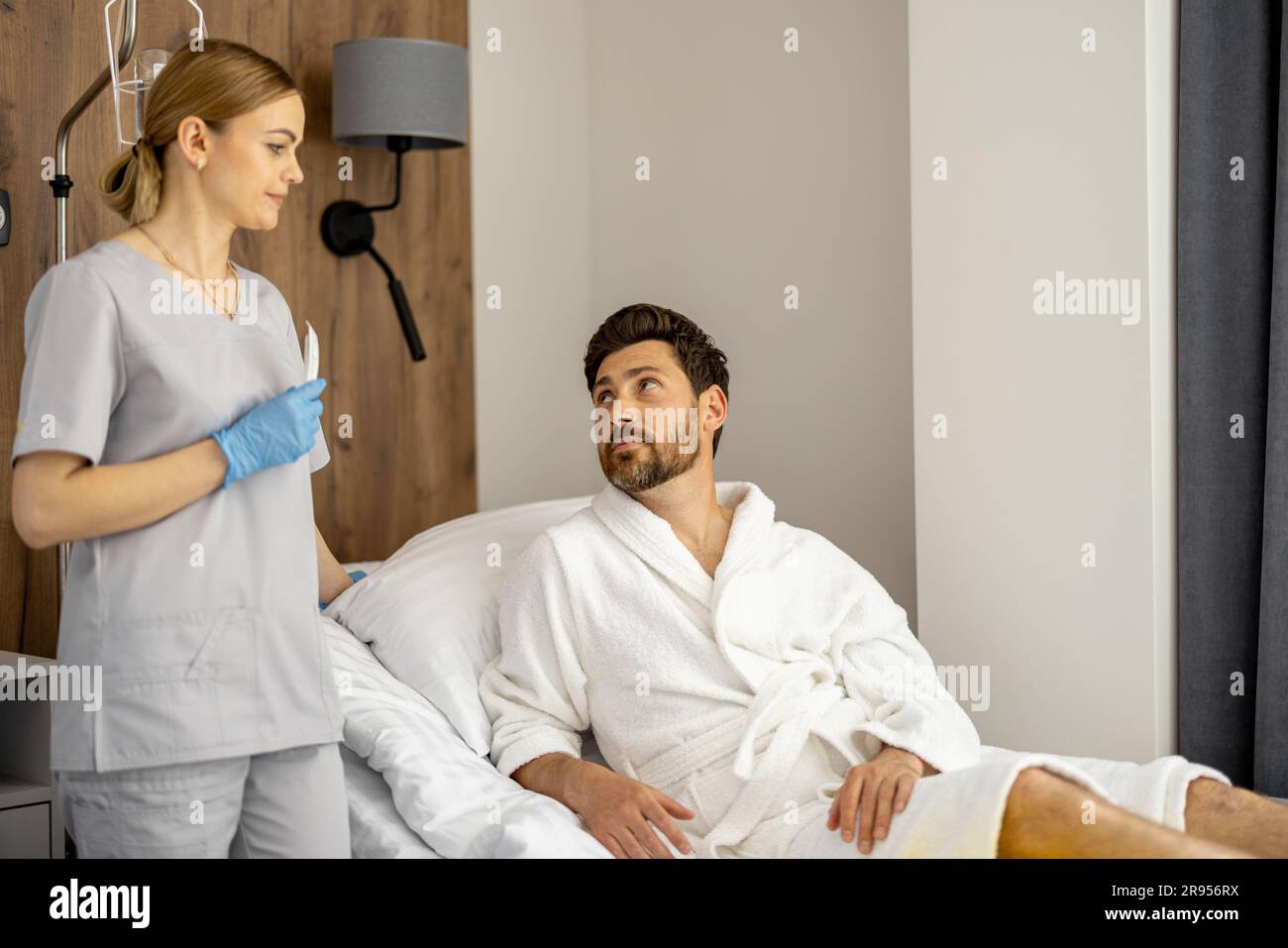 Nurse and patient in medical ward Stock Photo - Alamy