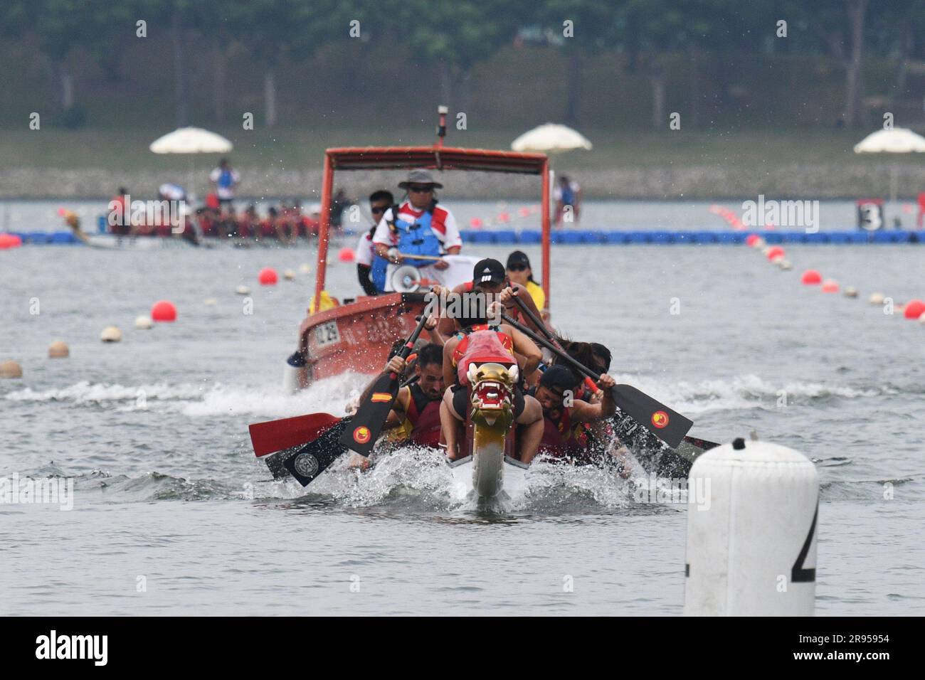 Singapore. 24th June, 2023. Dragon boat rowers compete during a dragon ...