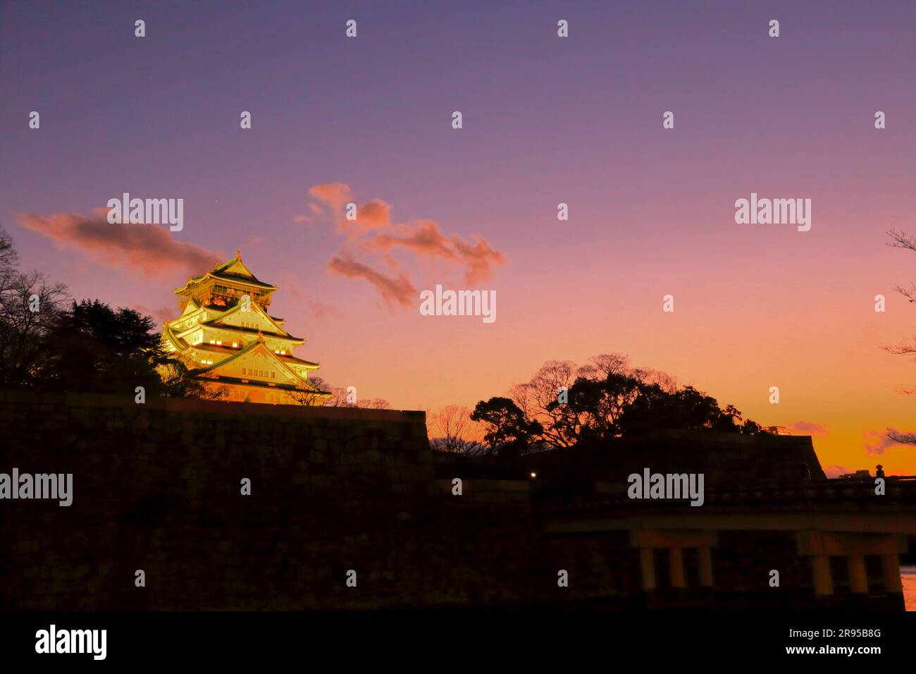 Osaka Castle at sunset Stock Photo - Alamy