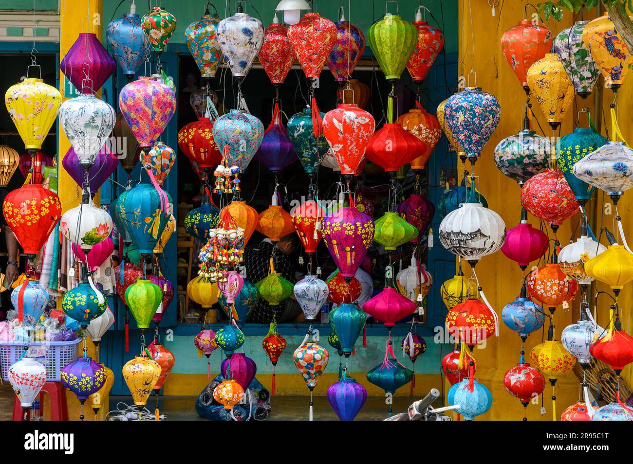 Traditional, colourful paper lanterns on display outside a shop in old ...