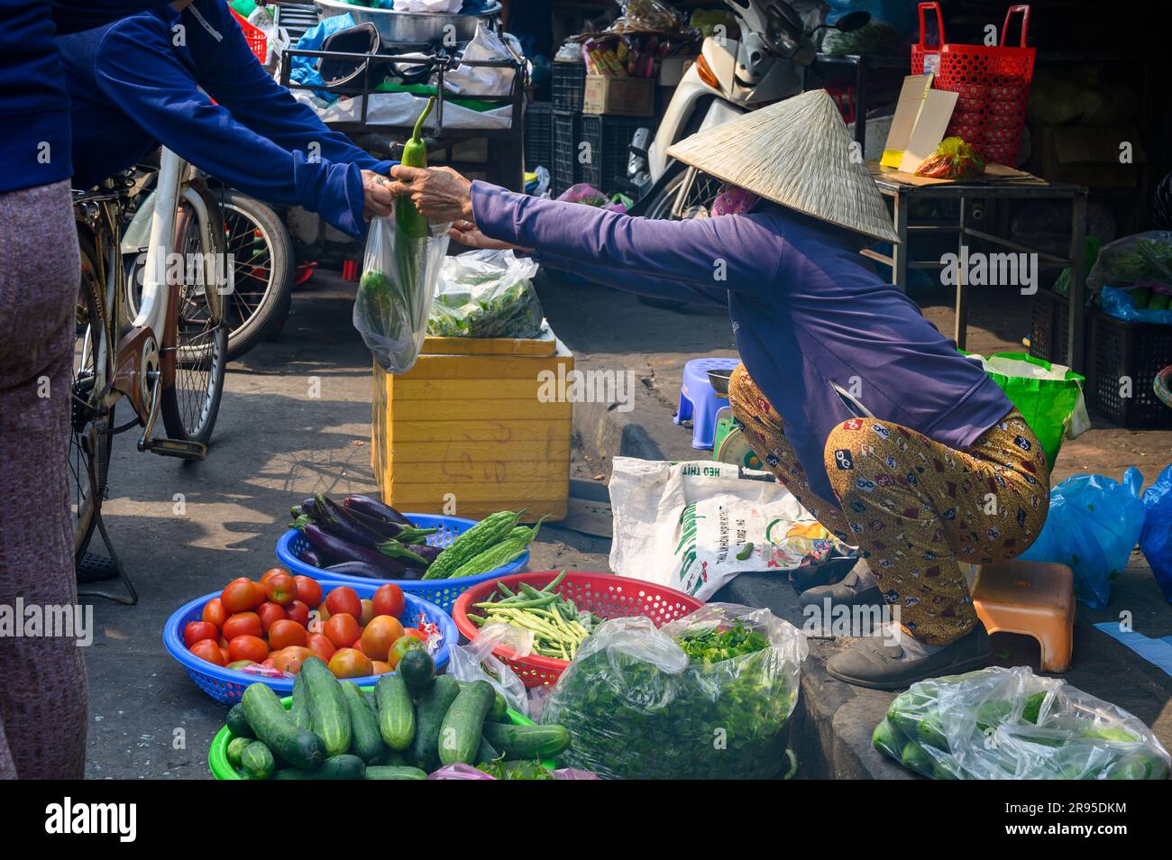 Buying and selling: A transaction takes place at a makeshift vegetable ...