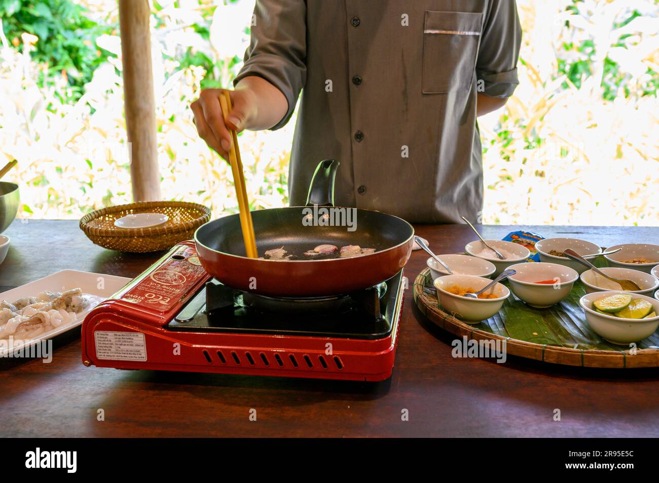 Chef and tutor demonstrates how to cook authentic Vietnamese food at ...
