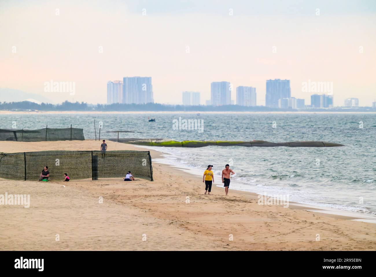 View across the East Vietnam Sea bay to Da Nang skyline from the beach ...