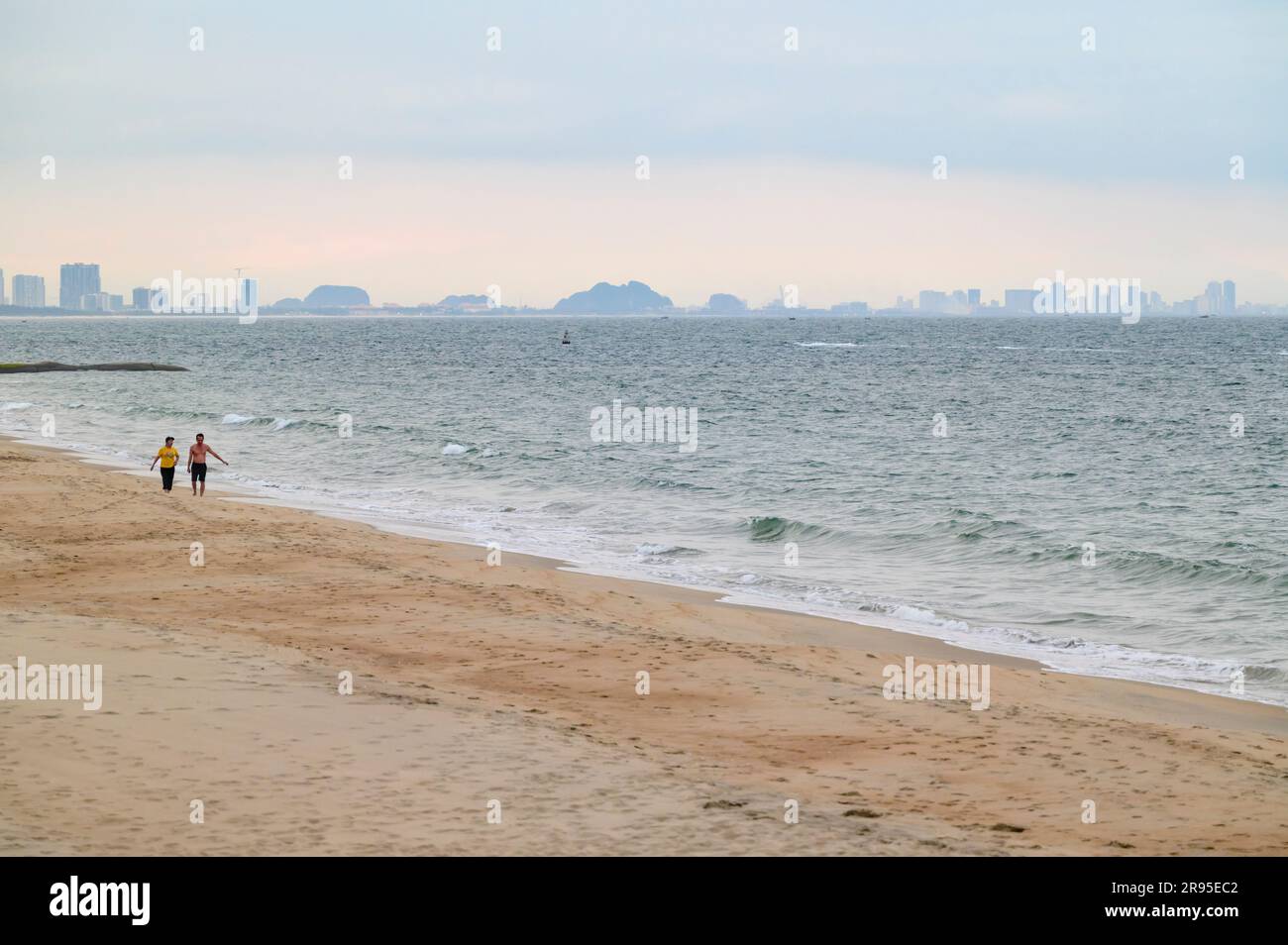 View across the East Vietnam Sea bay to Da Nang skyline from the beach ...