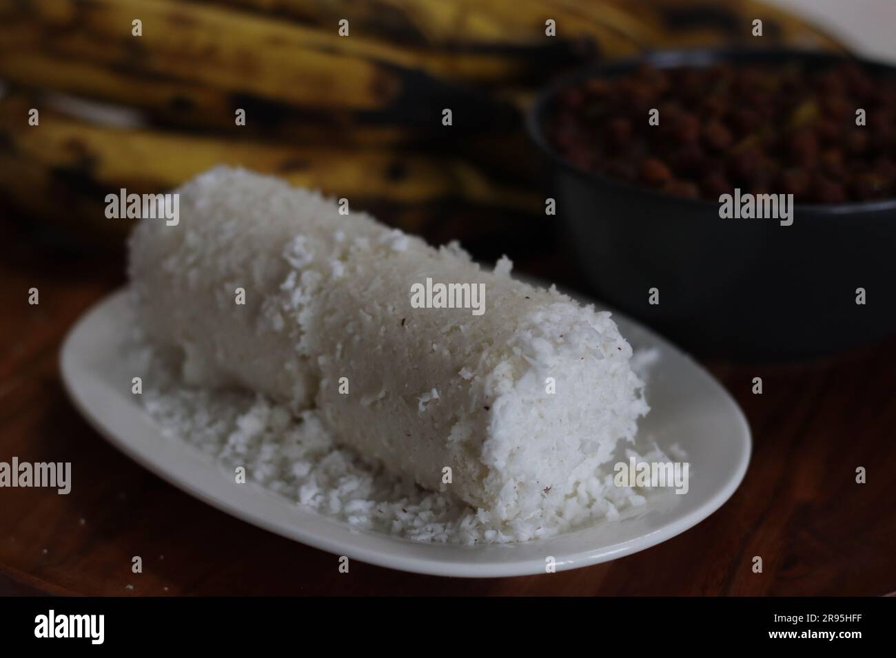 Puttu with kadala curry. Steamed rice cake made of rice flour and ...