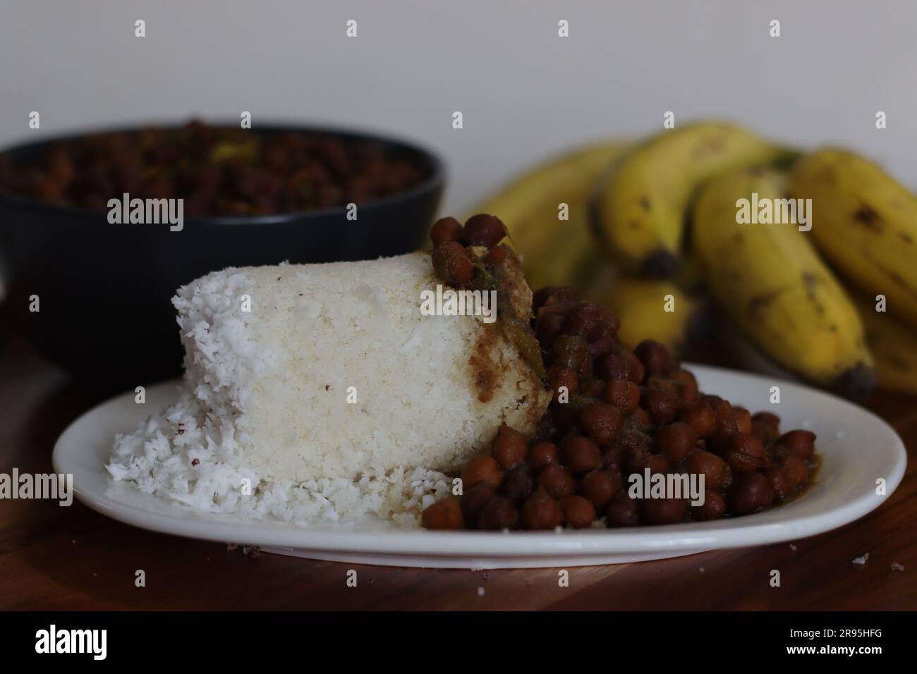 Puttu with kadala curry. Steamed rice cake made of rice flour and ...