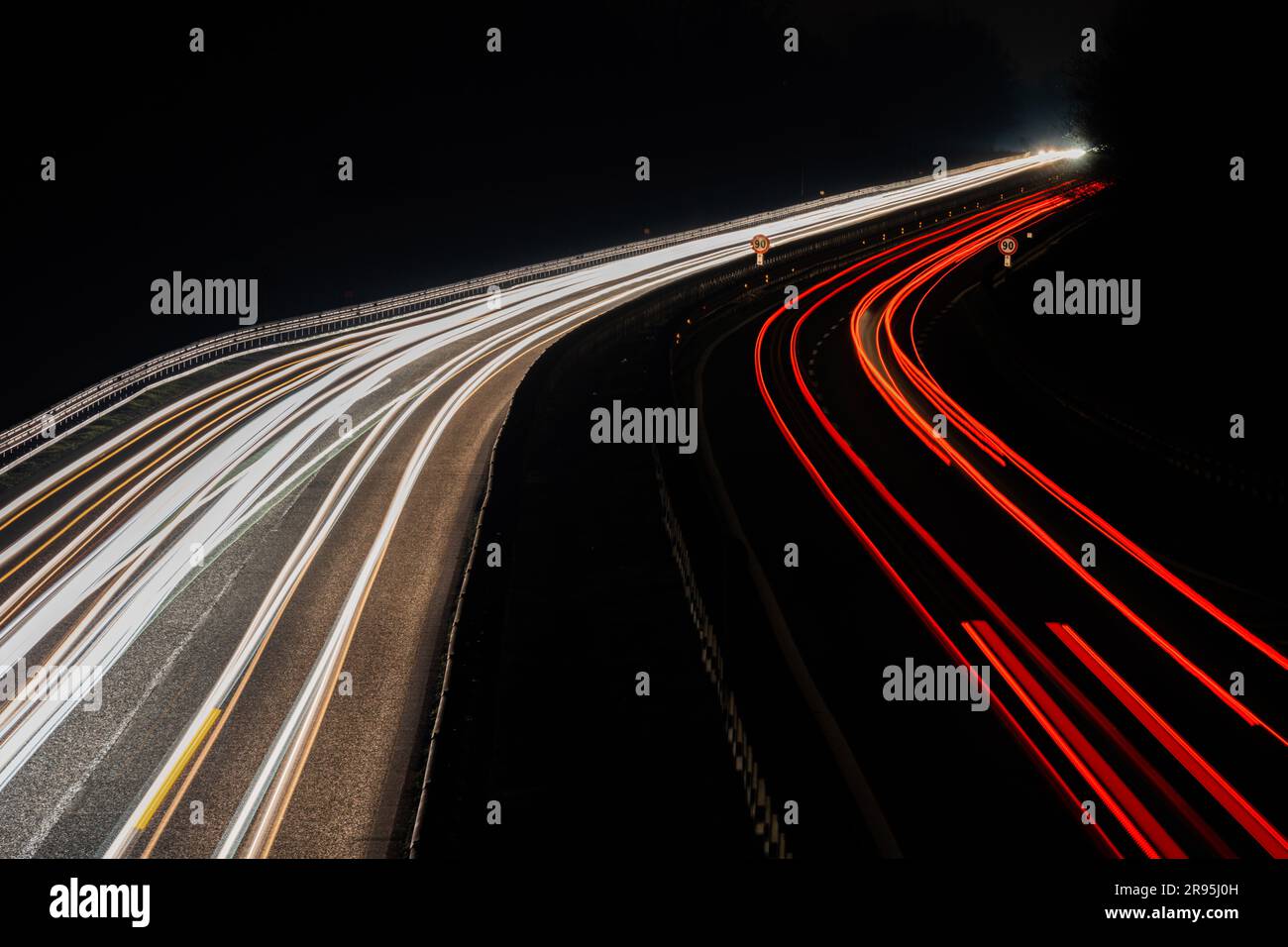 Abstract image of night traffic lights on the road. Car light trails at ...