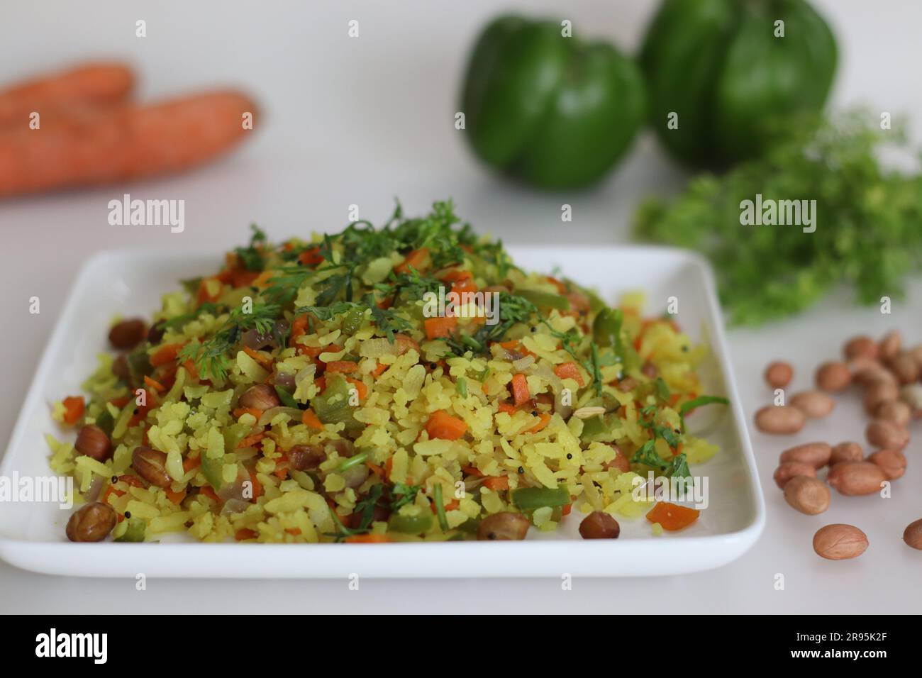 Vegetable Poha is a quick breakfast or snack made of beaten rice or ...