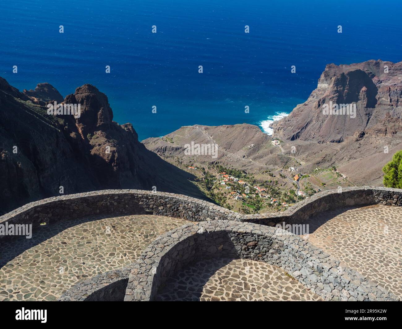 View of green valley with palm trees, cacti and sharp cliffs of La ...