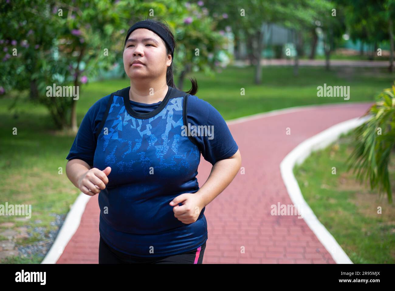 asian fat woman running in the park Stock Photo - Alamy