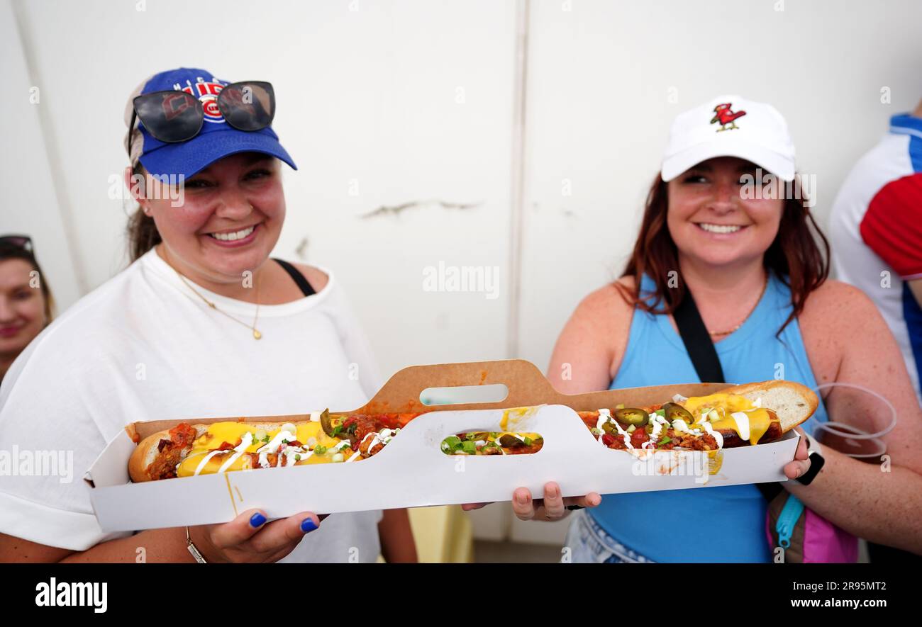 Fans pose with an ultra-long carrier of nachos ahead of the MLB London ...