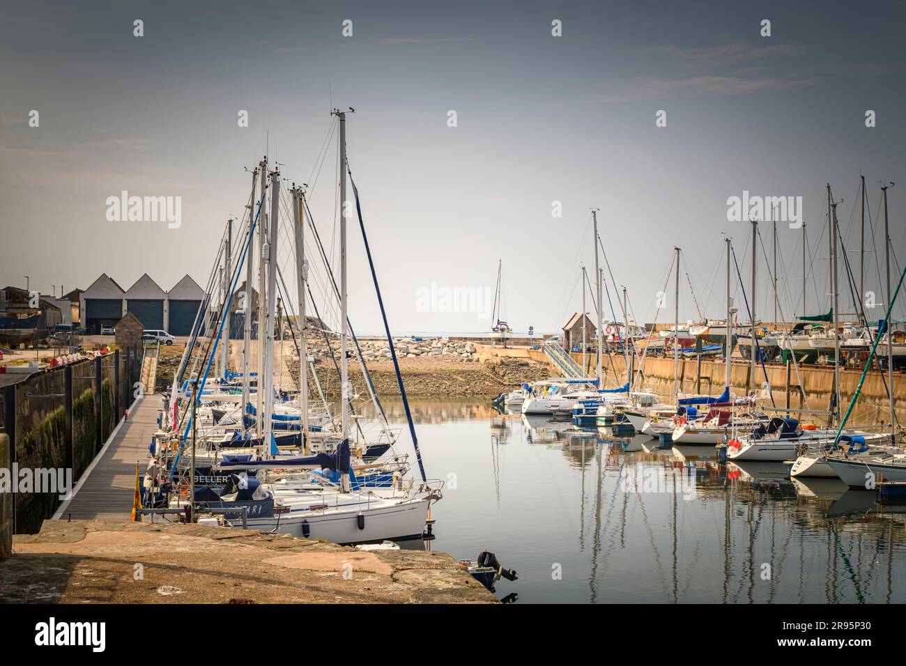 A warm, summer HDR image of Branderburgh harbour full of yachts, the ...