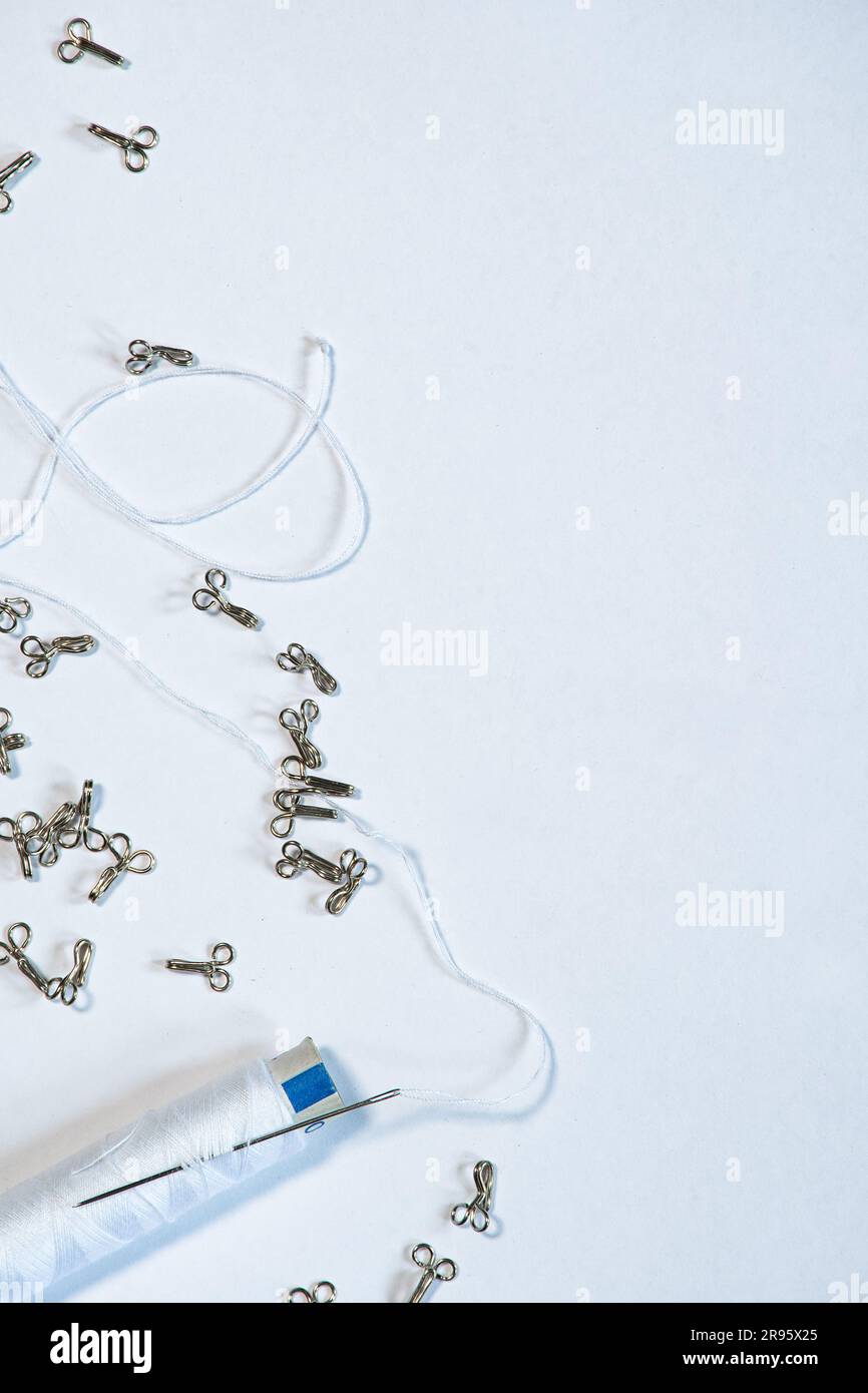 Close-up of a white color thread spool of the sewing machine with a ...