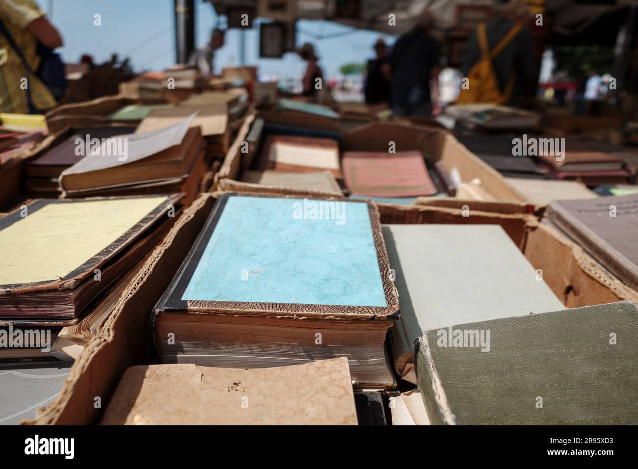 Selective focus at stack and row of second hand vintage books are sold ...