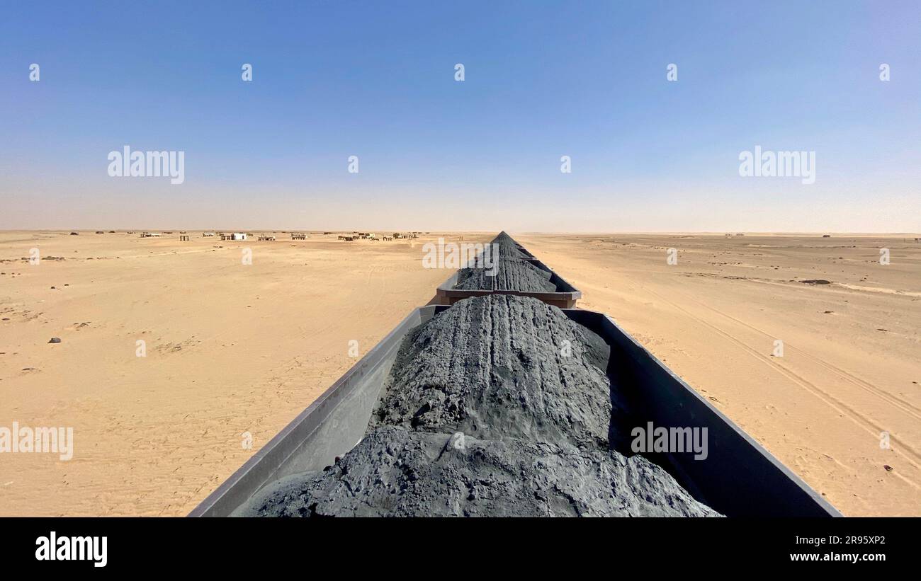 A cargo train pictured in a desert landscape. Mauritania Stock Photo ...
