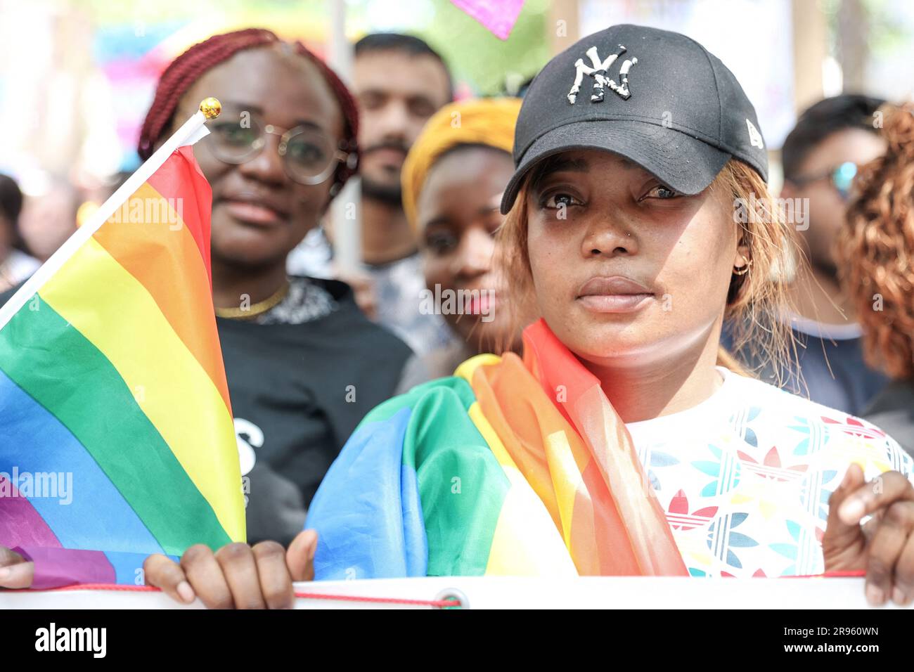 Paris, France. 24th June, 2023. A demonstrator with a LGBT flag parades ...