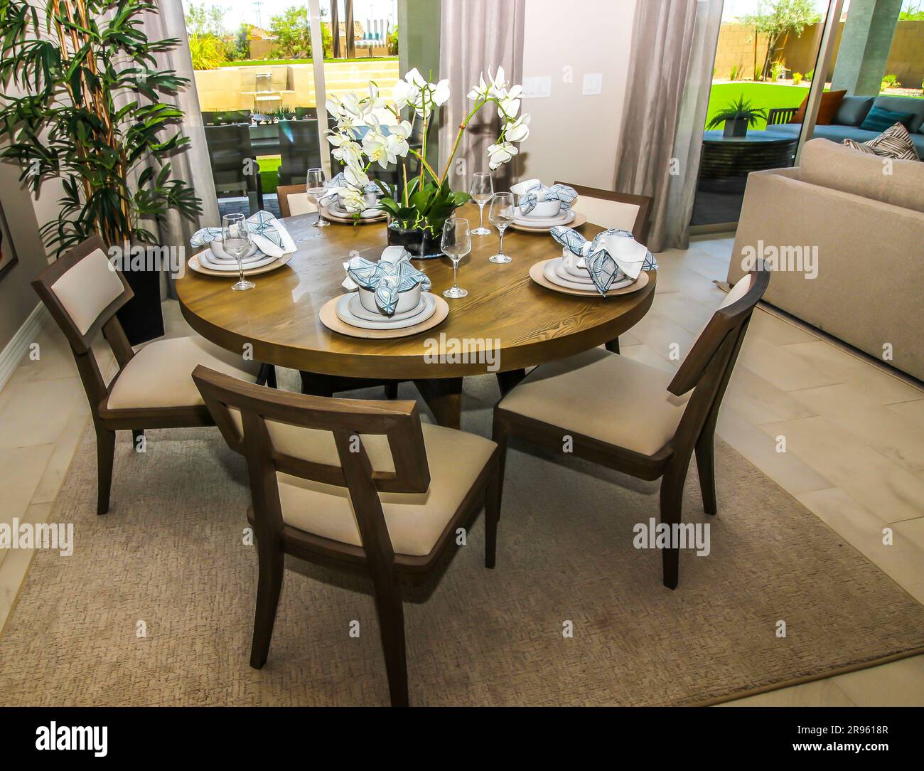 Dining Area Table With Five Place Settings Stock Photo - Alamy