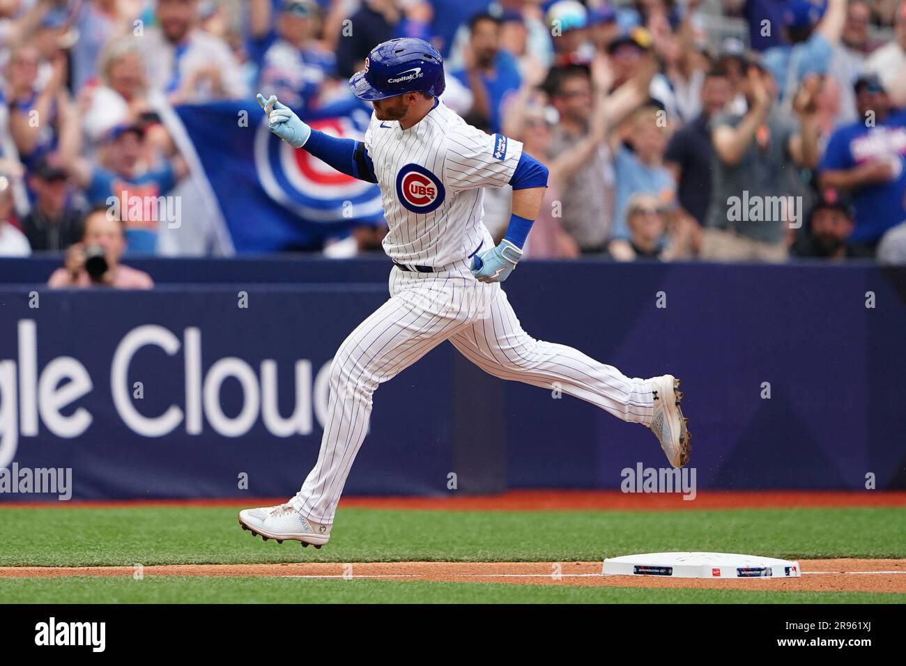 Chicago Cubs’ Ian Happ completes a a free run after hitting a home run ...