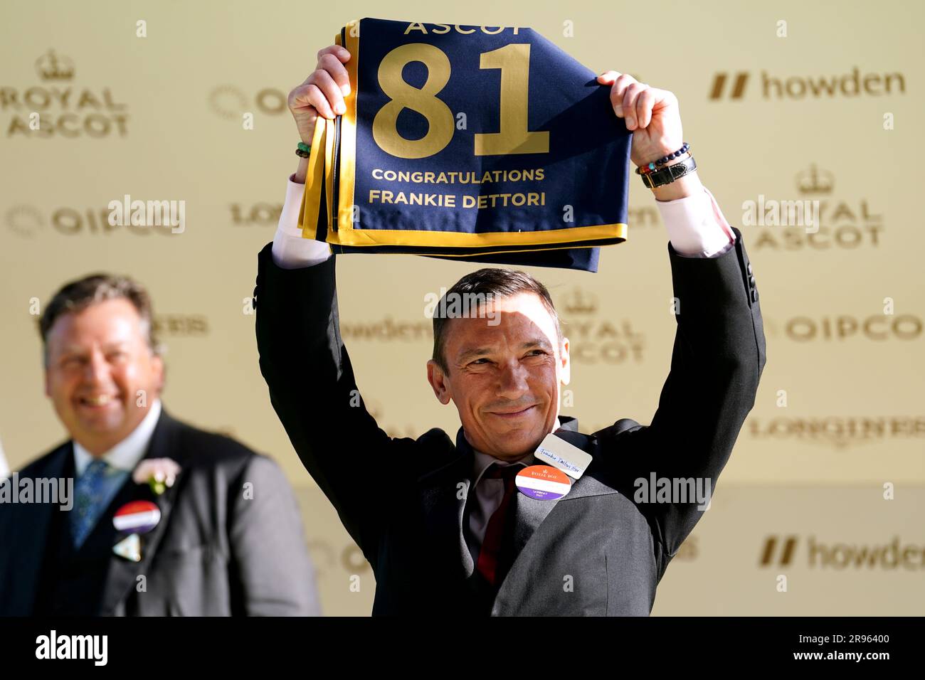 Jockey Frankie Dettori holds up a saddle cloth celebrating his 81 Ascot ...