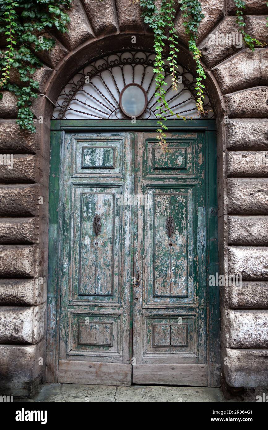Old wooden door of a mansion in Roma city Stock Photo - Alamy