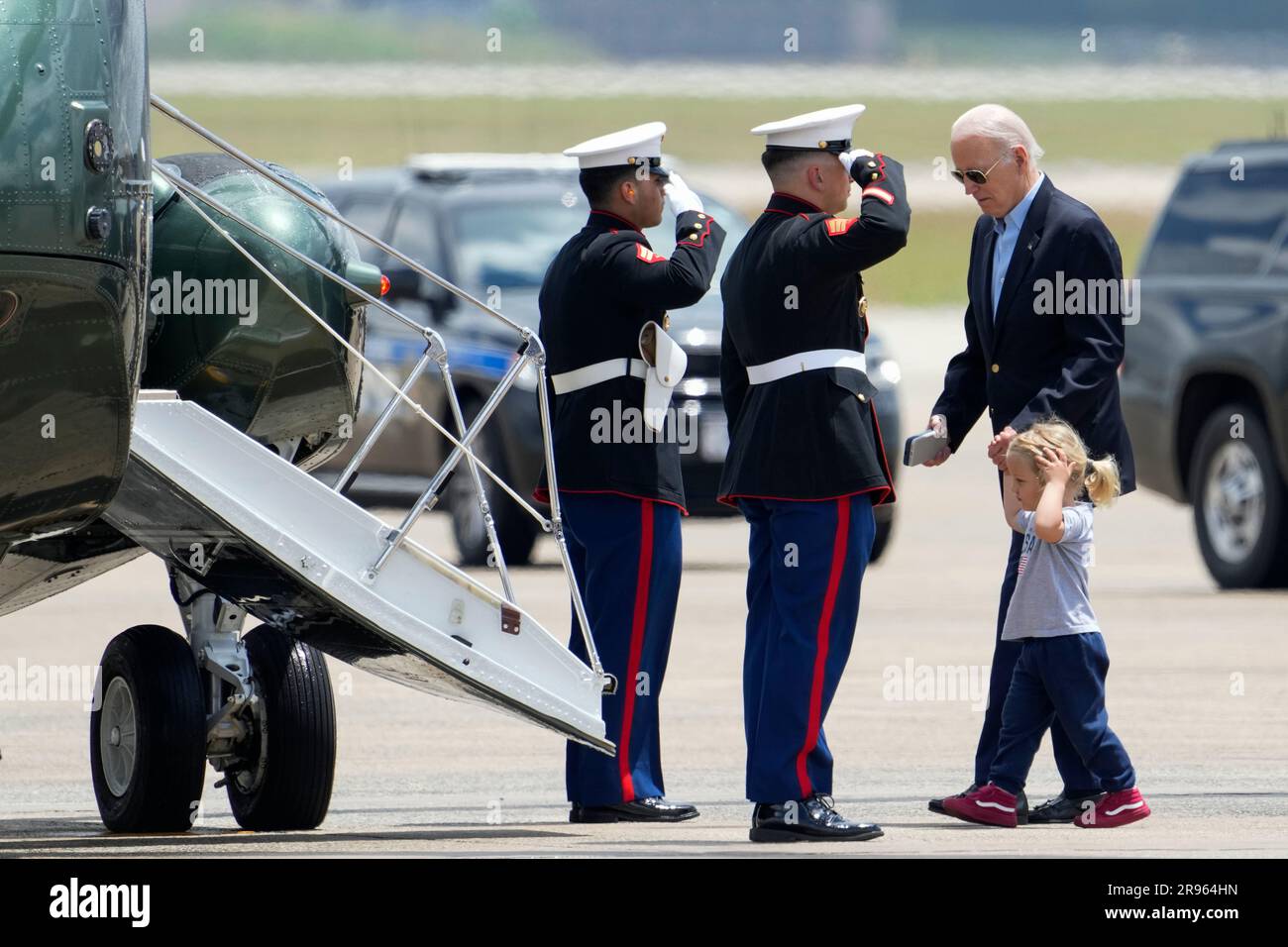 President Joe Biden walks to board Marine One with his grandson Beau ...