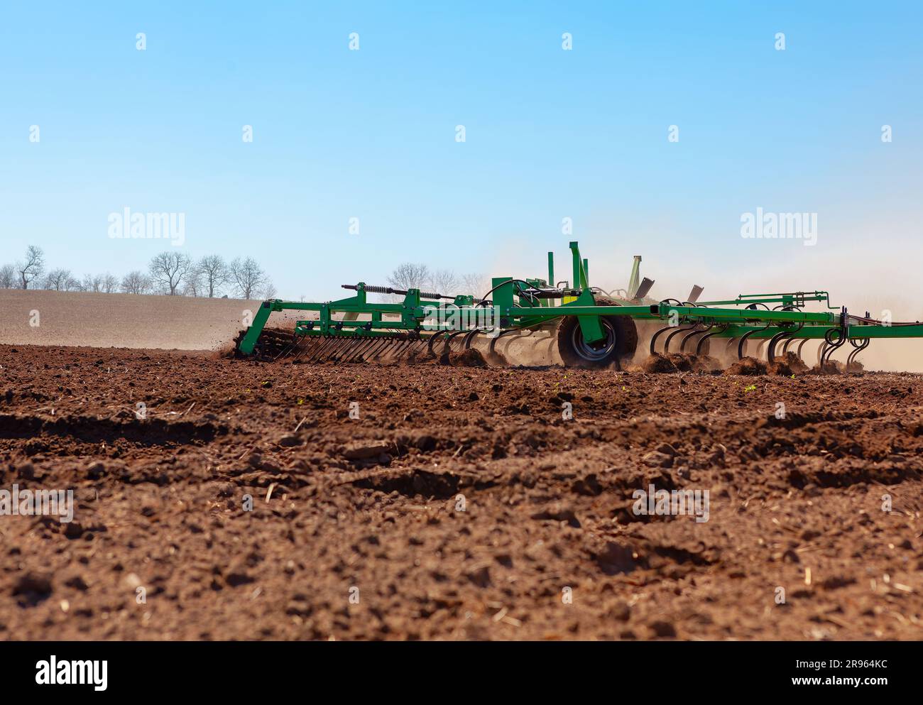Seeding plow preparing land with seedbed cultivator Stock Photo - Alamy
