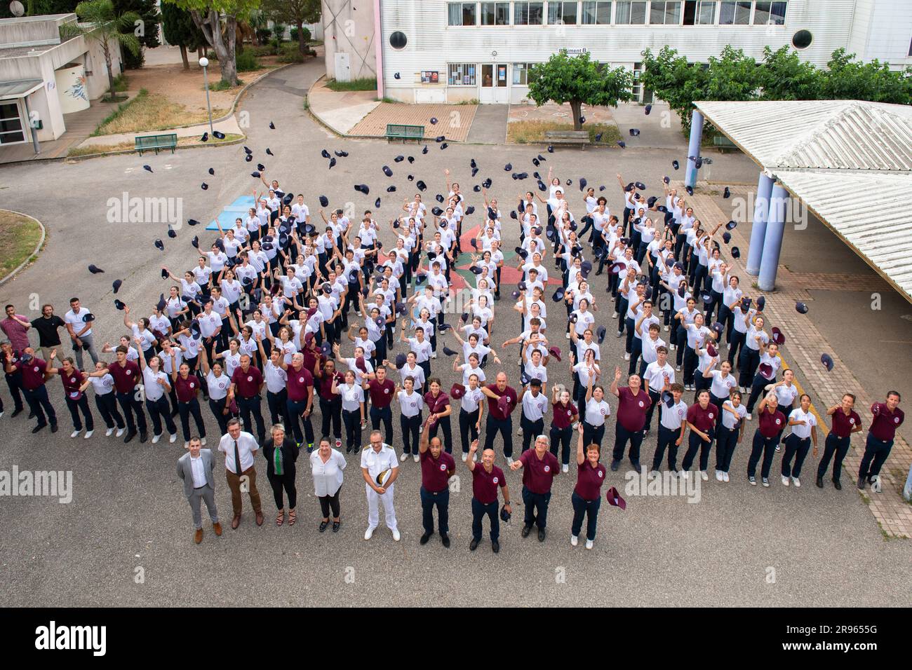 Attendees throw their caps in the air at the end of the ceremony. 168 ...