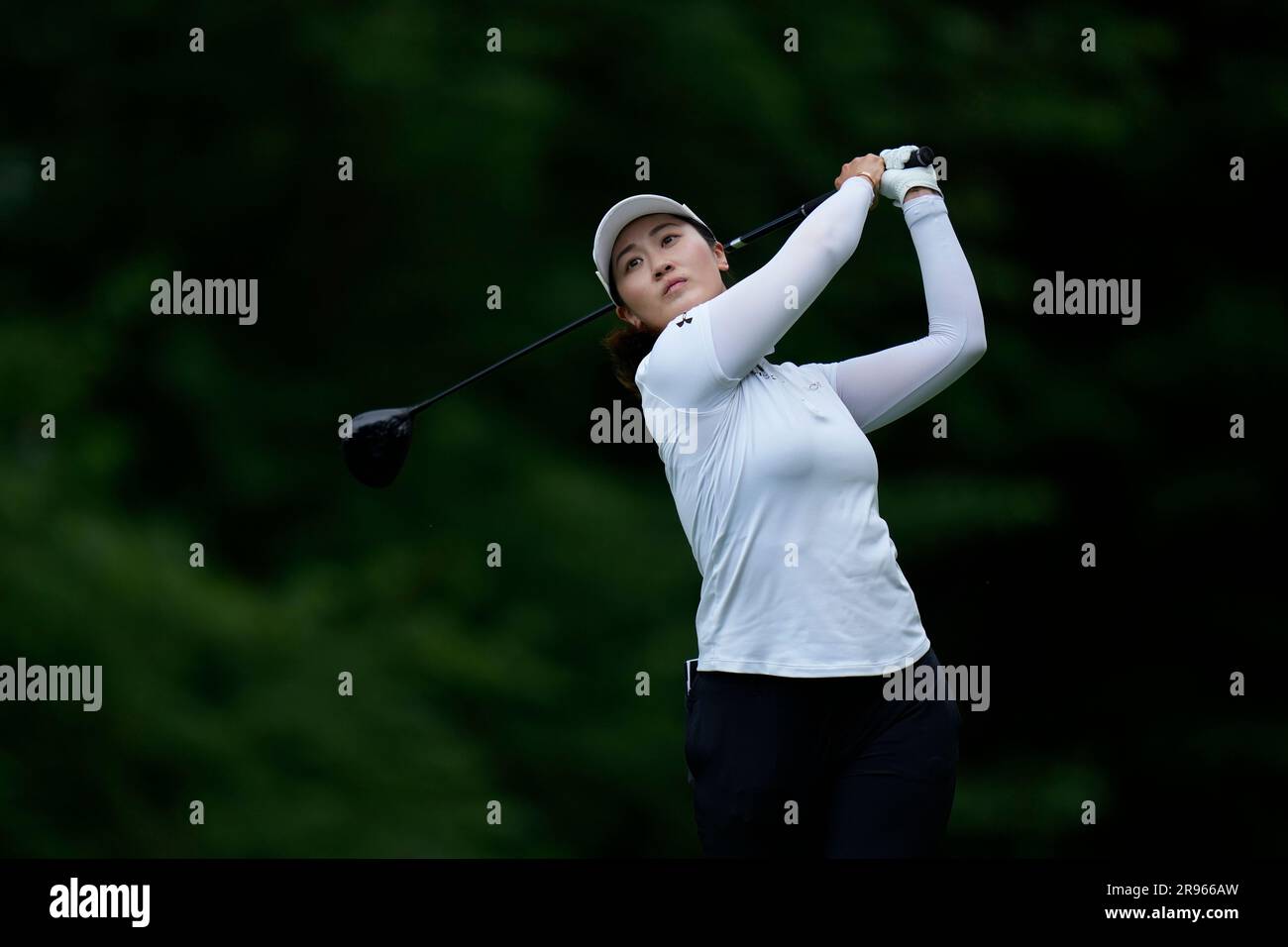 Xiyu Lin, of China, hits off the tee on the third hole during the third ...