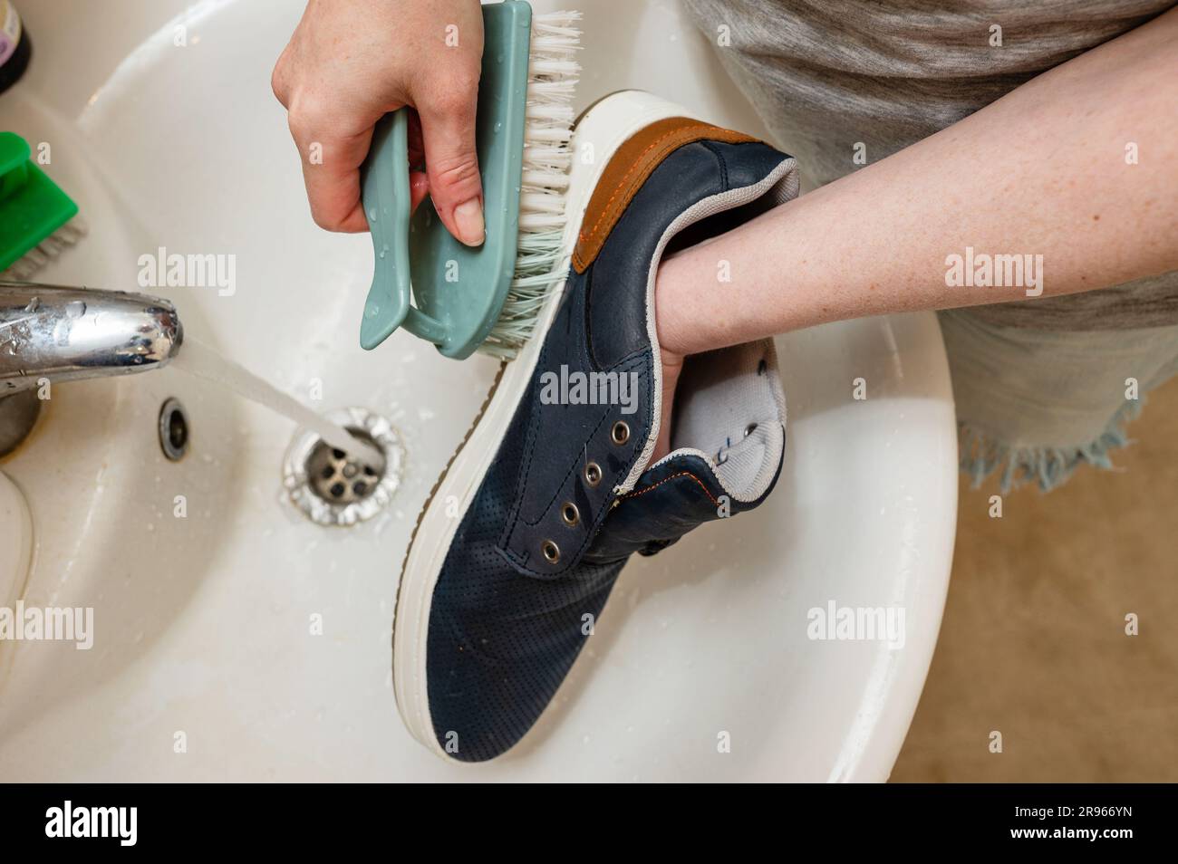 Shoe cleaning with a special shoe care product. Close-up Stock Photo ...