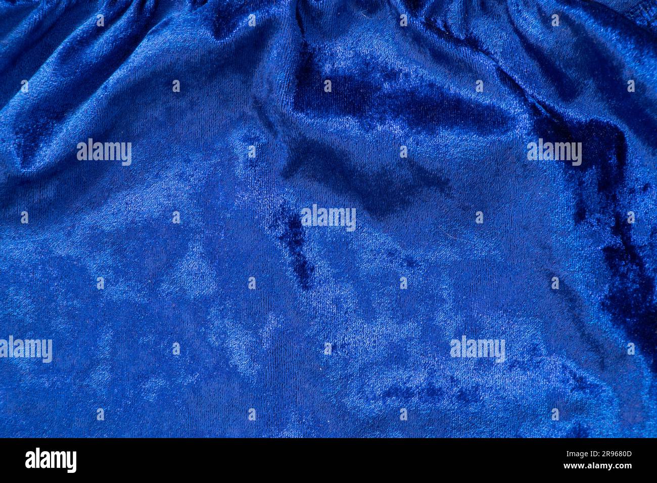 plain blue wrinkled fabric close-up as background, fabric texture Stock ...