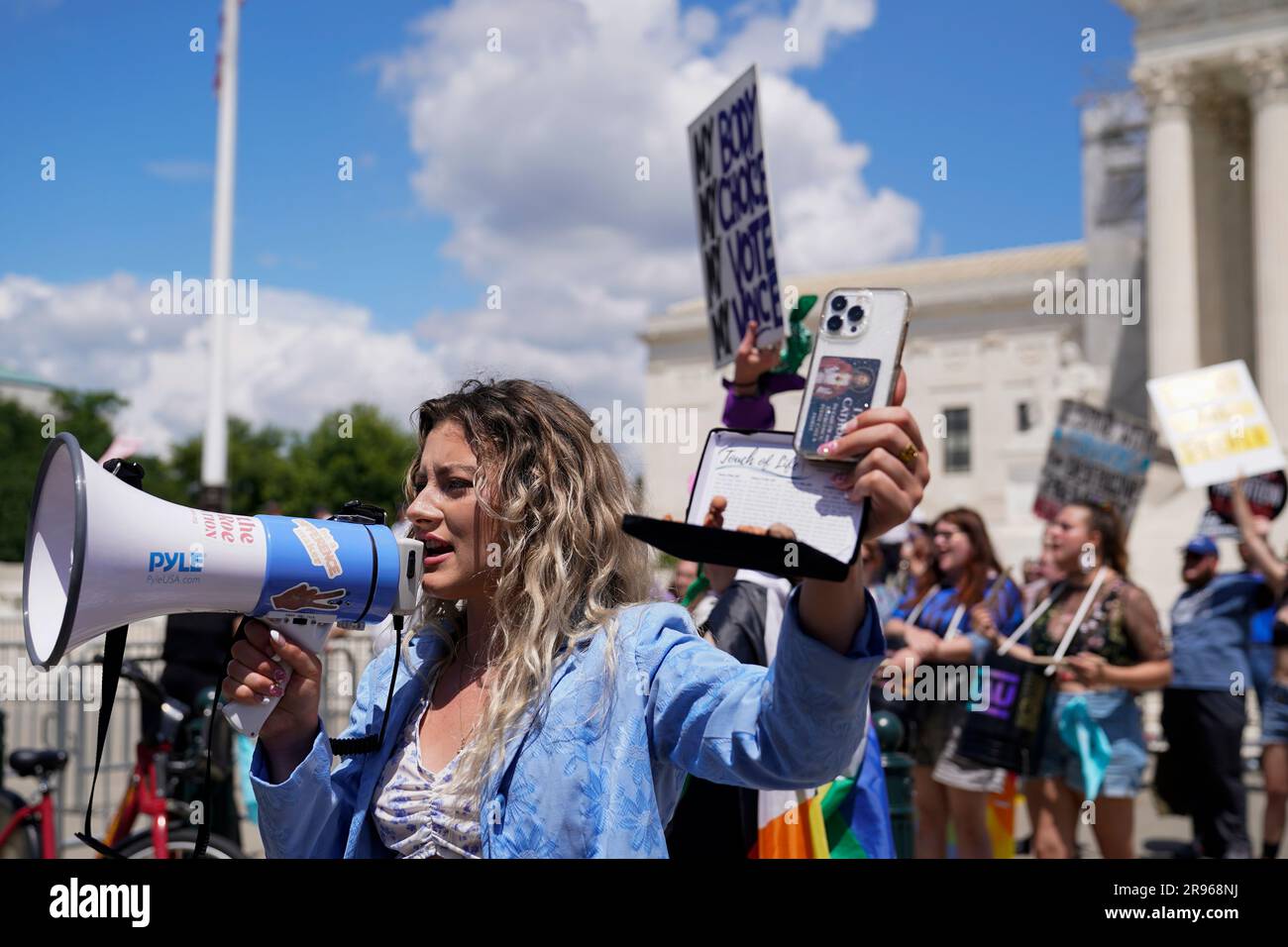 An anti-abortion activist speaks into a megaphone outside the Supreme ...