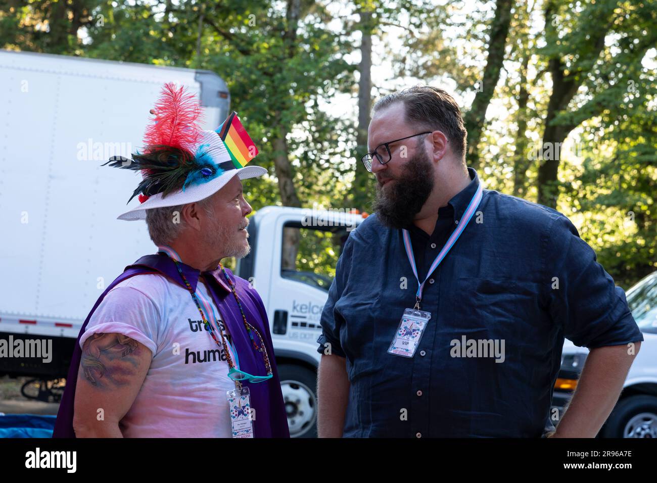 Washington State Senator Marko Liias speaks to an organizer backstage ...