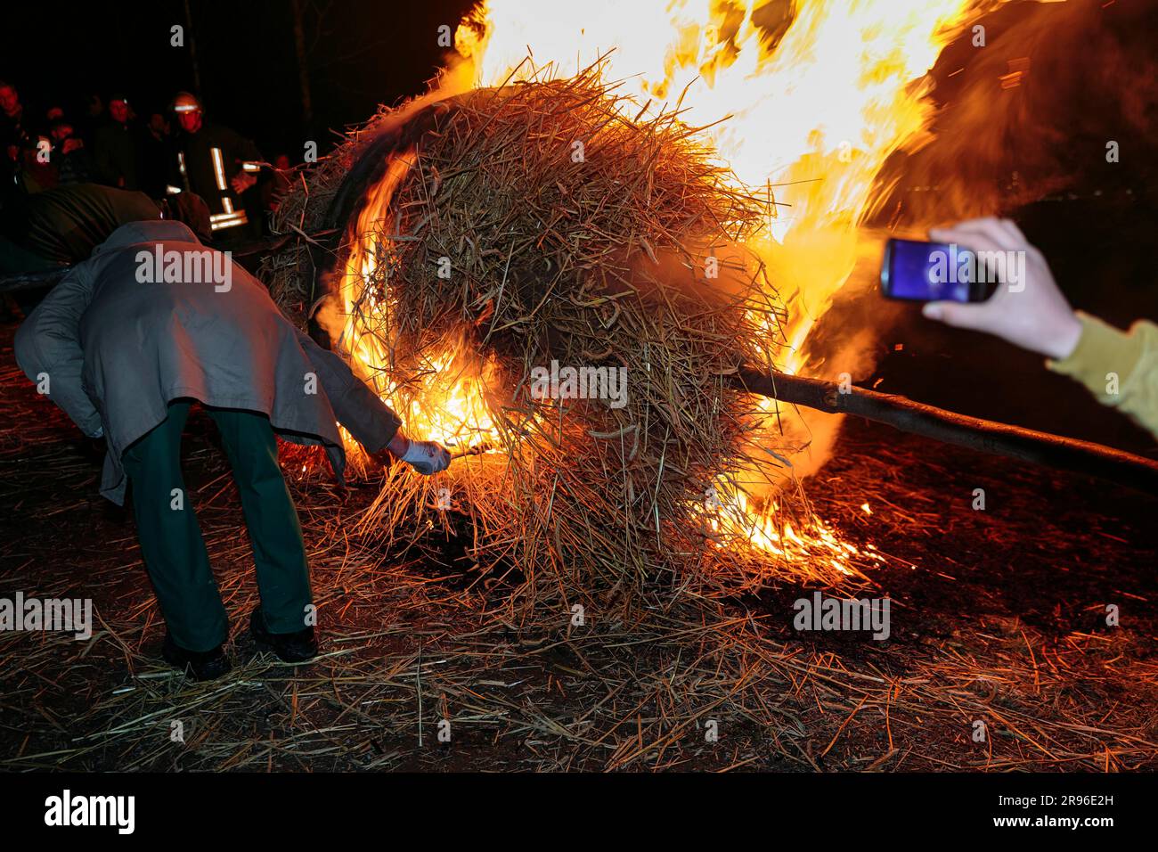 Lighting the straw, fire wheel, Easter wheel, burning wooden wheel at ...