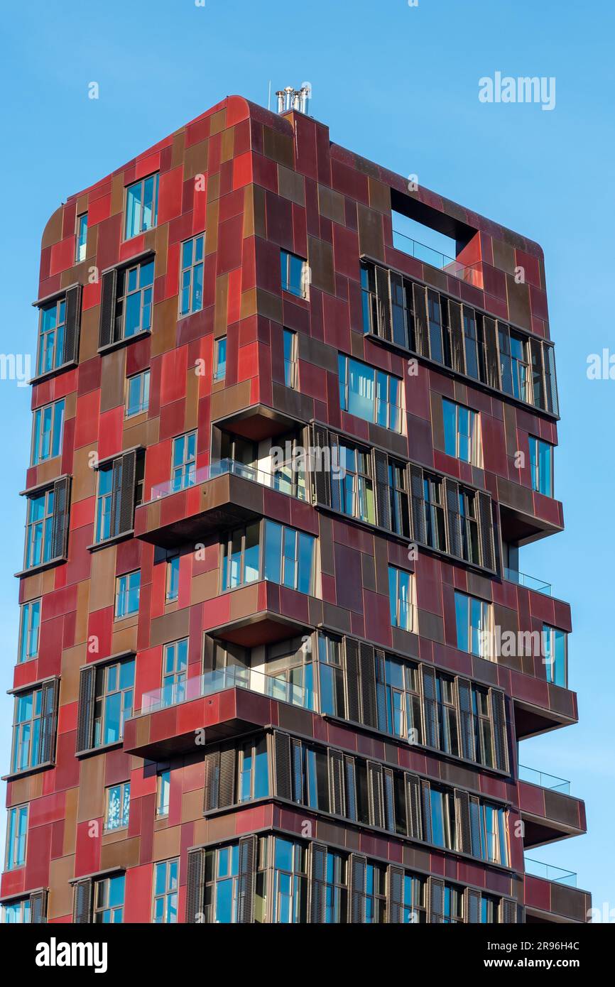Modern red high-rise residential building in the Hafencity in Hamburg ...