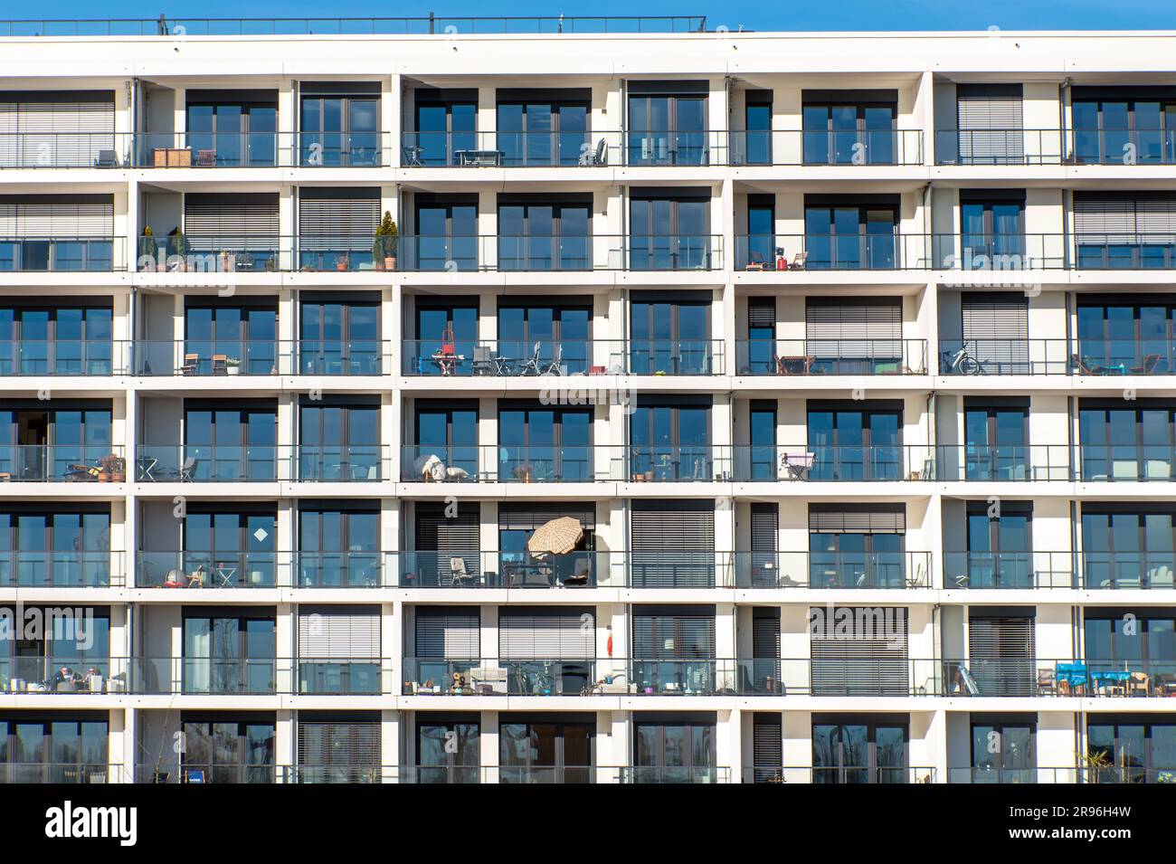 Facade of a modern apartment building with many balconies seen in ...