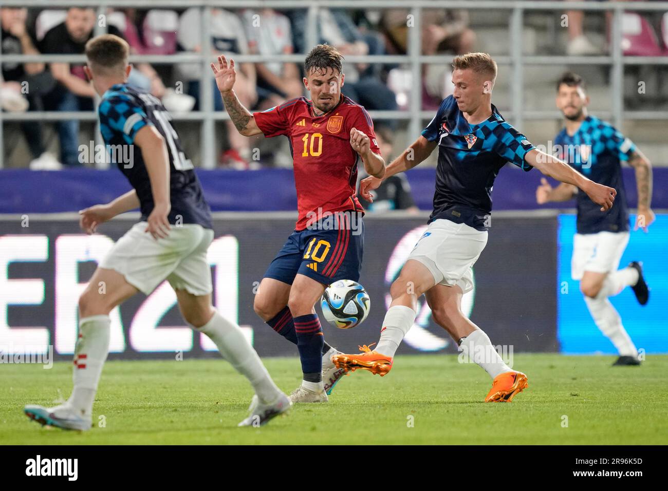 Rodri Sanchez of Spain, center, challenges for the ball with Croatia's ...