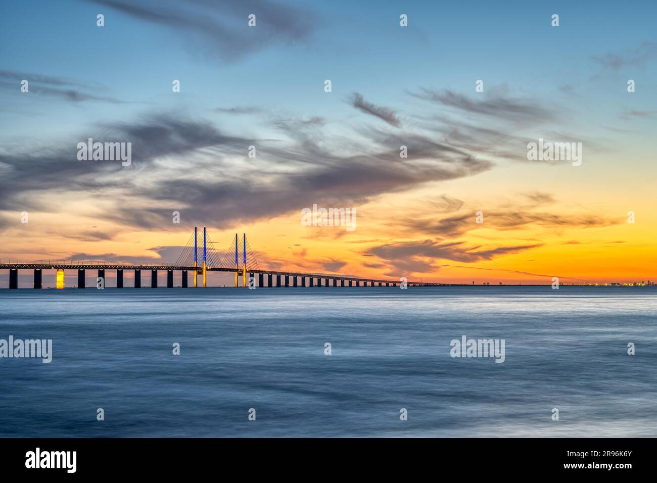The famous Oeresund Bridge after sunset with the lights of Copenhagen ...