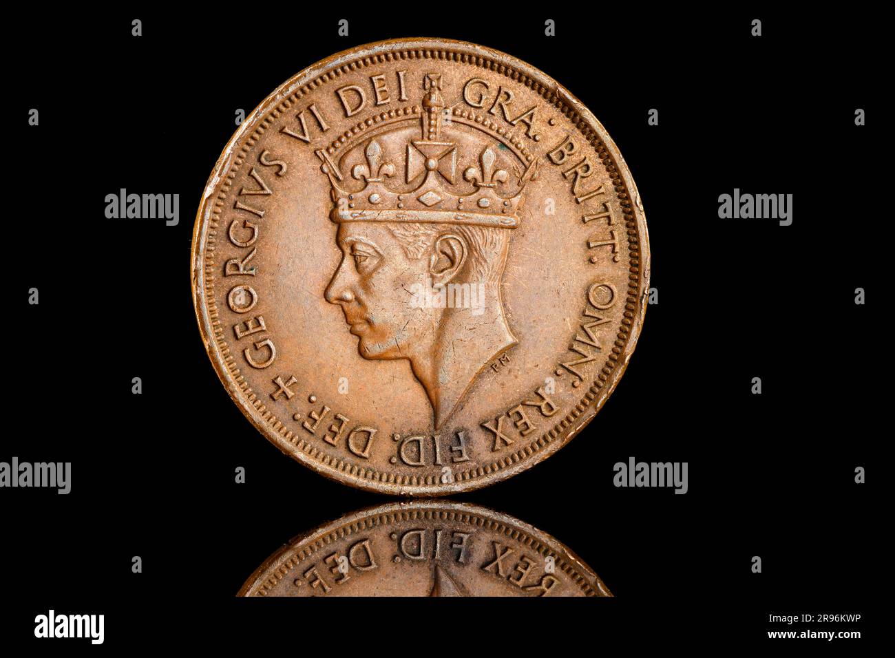 1945 one twelth of a shilling featuring a crowned portrait of George VI ...
