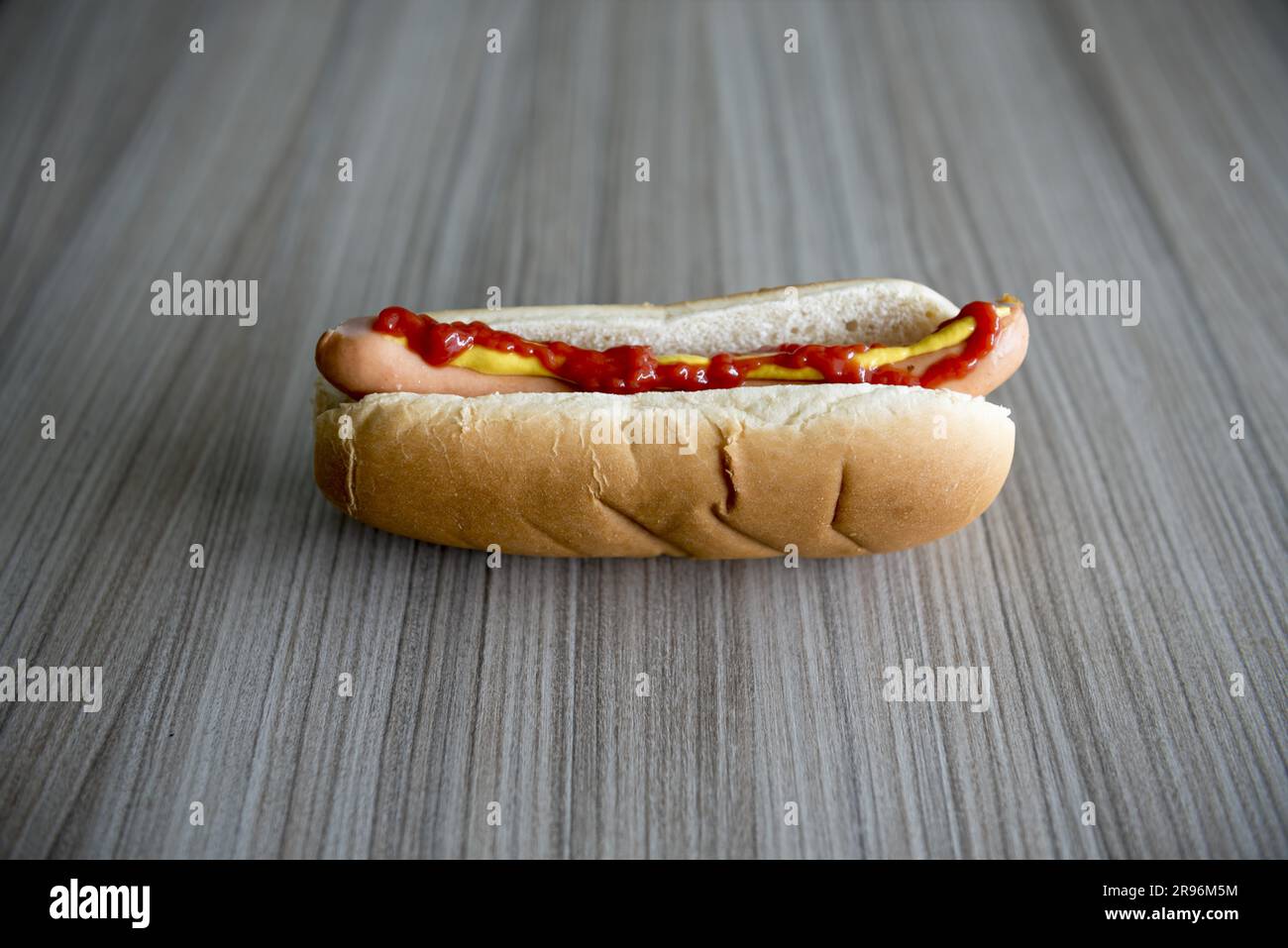 Hot Dog on wood table Stock Photo - Alamy