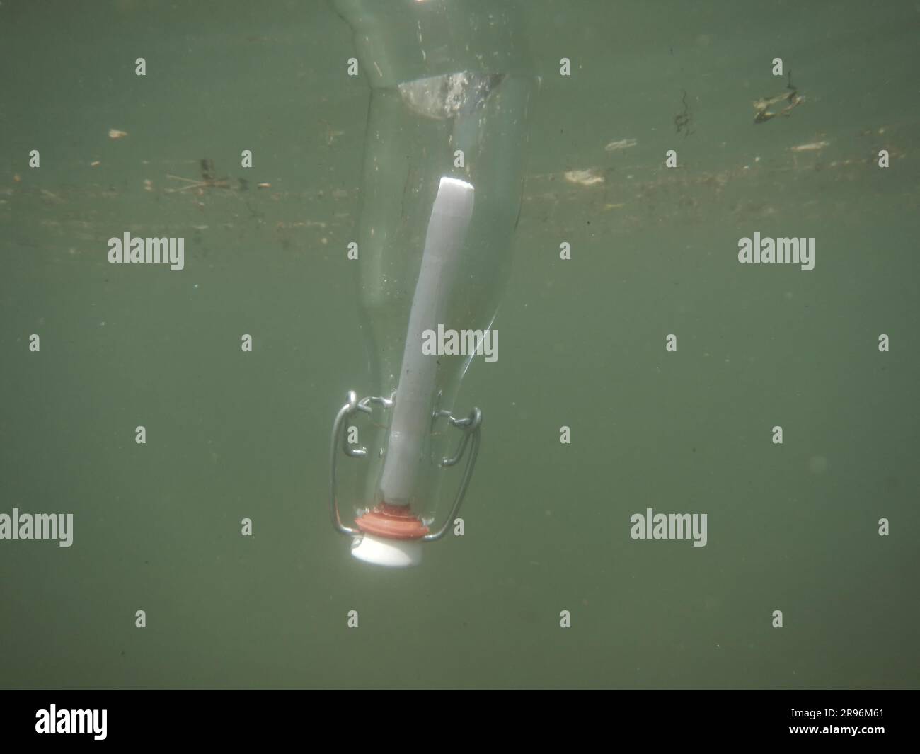Message in a bottle and floating underwater Stock Photo - Alamy