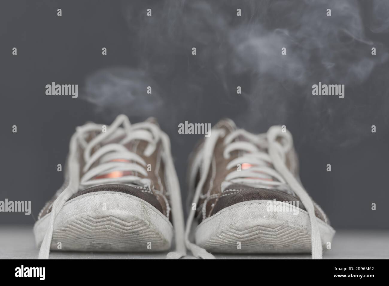 Pair of shoes with smoke and fire Stock Photo - Alamy