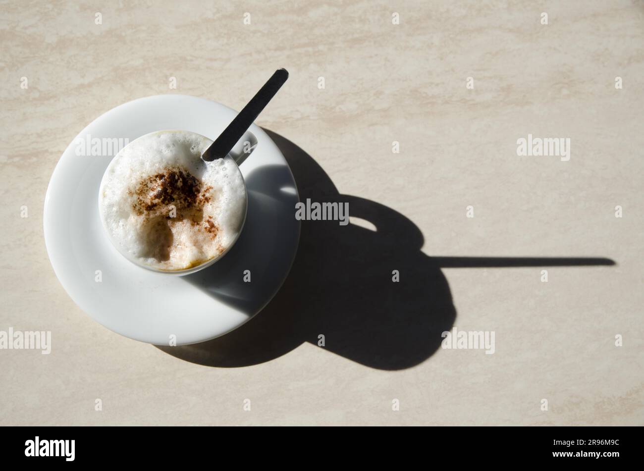 Cup of coffee with shadow Stock Photo - Alamy