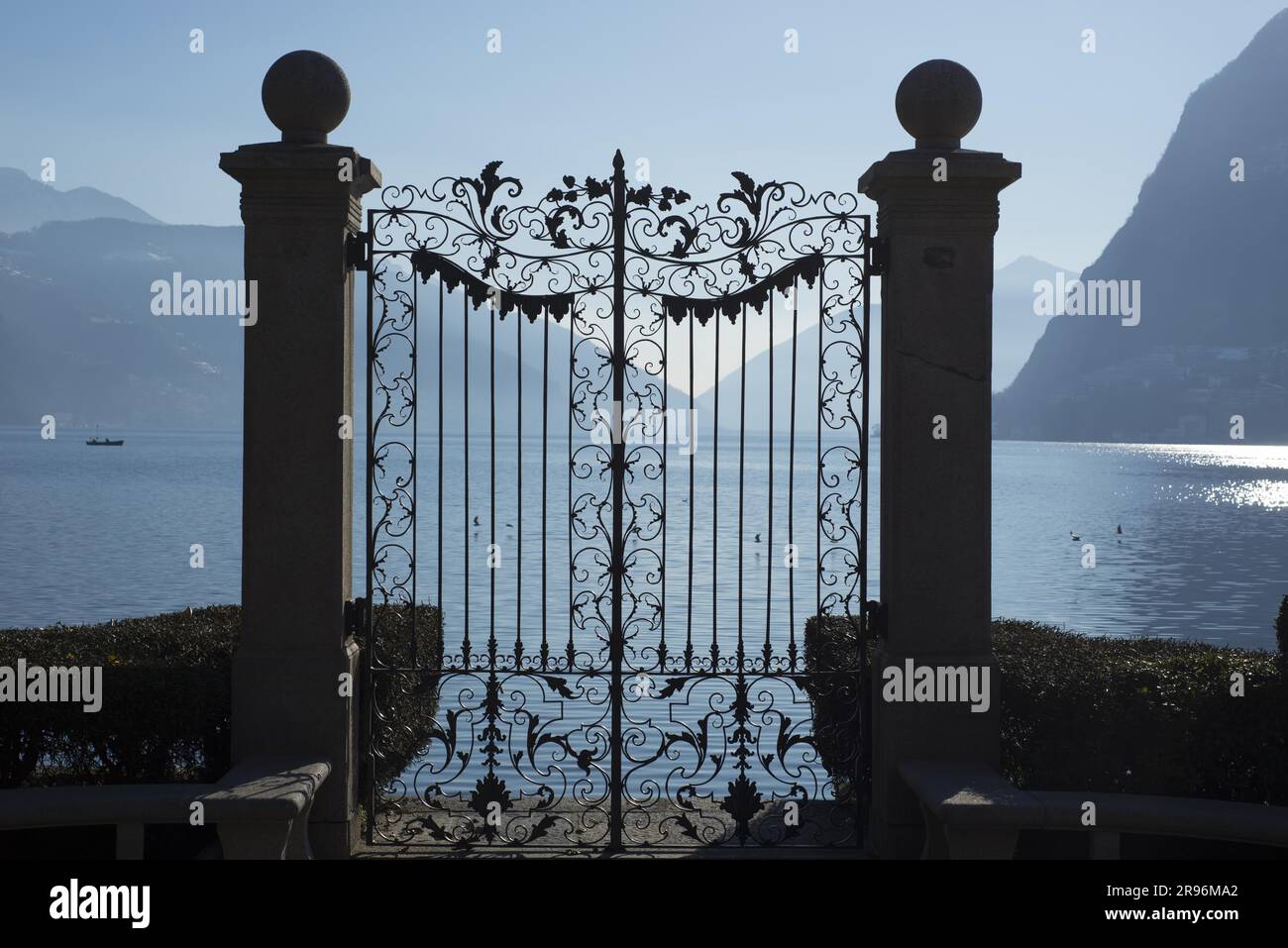 Gate on the lakefront with mountain in Switzerland Stock Photo - Alamy