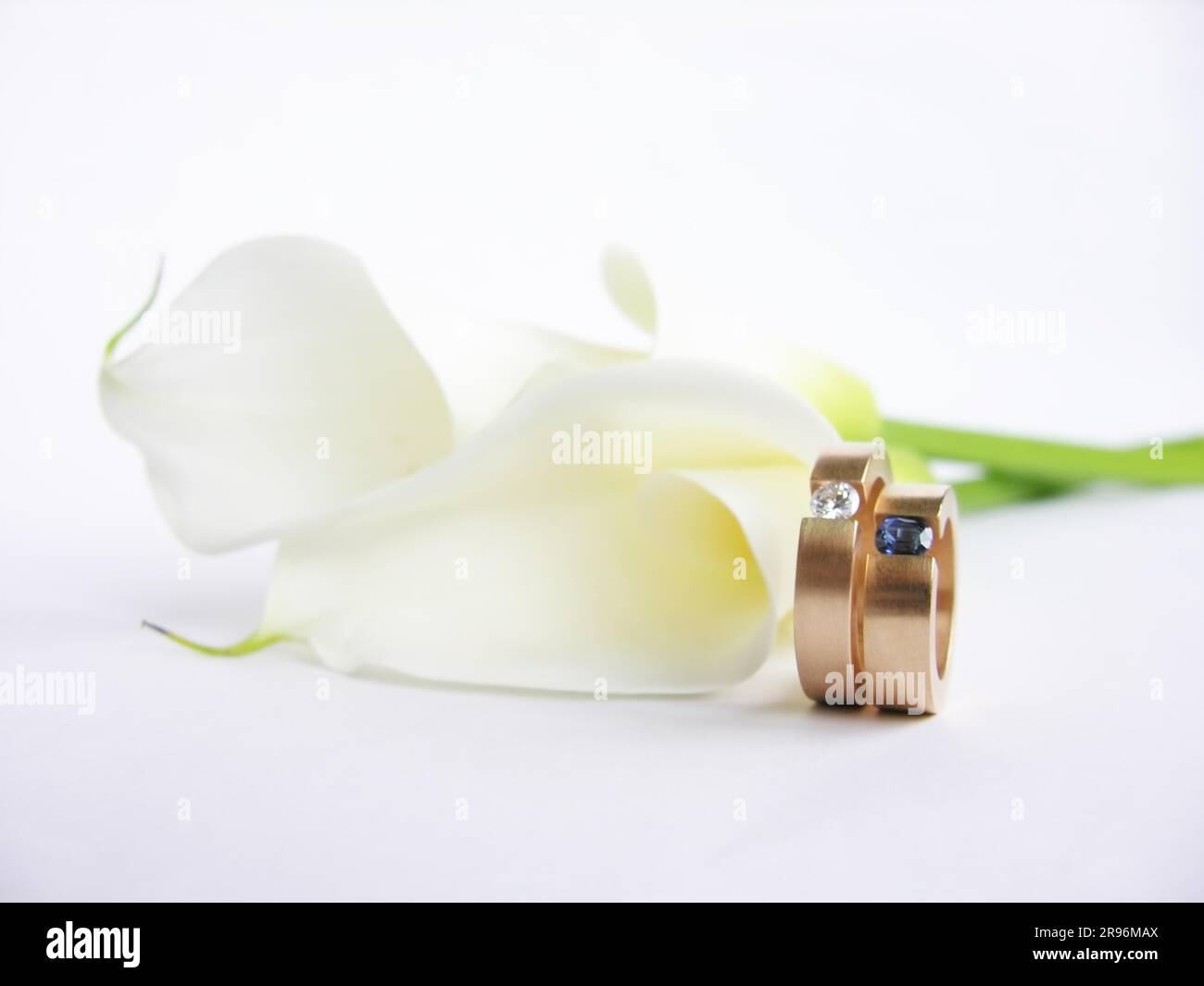 Wedding Rings with Calla Flower Stock Photo - Alamy