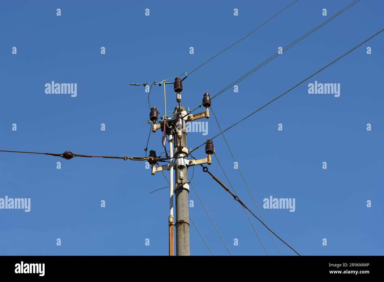 Old Electricity Pylon with Blue Sky Stock Photo - Alamy